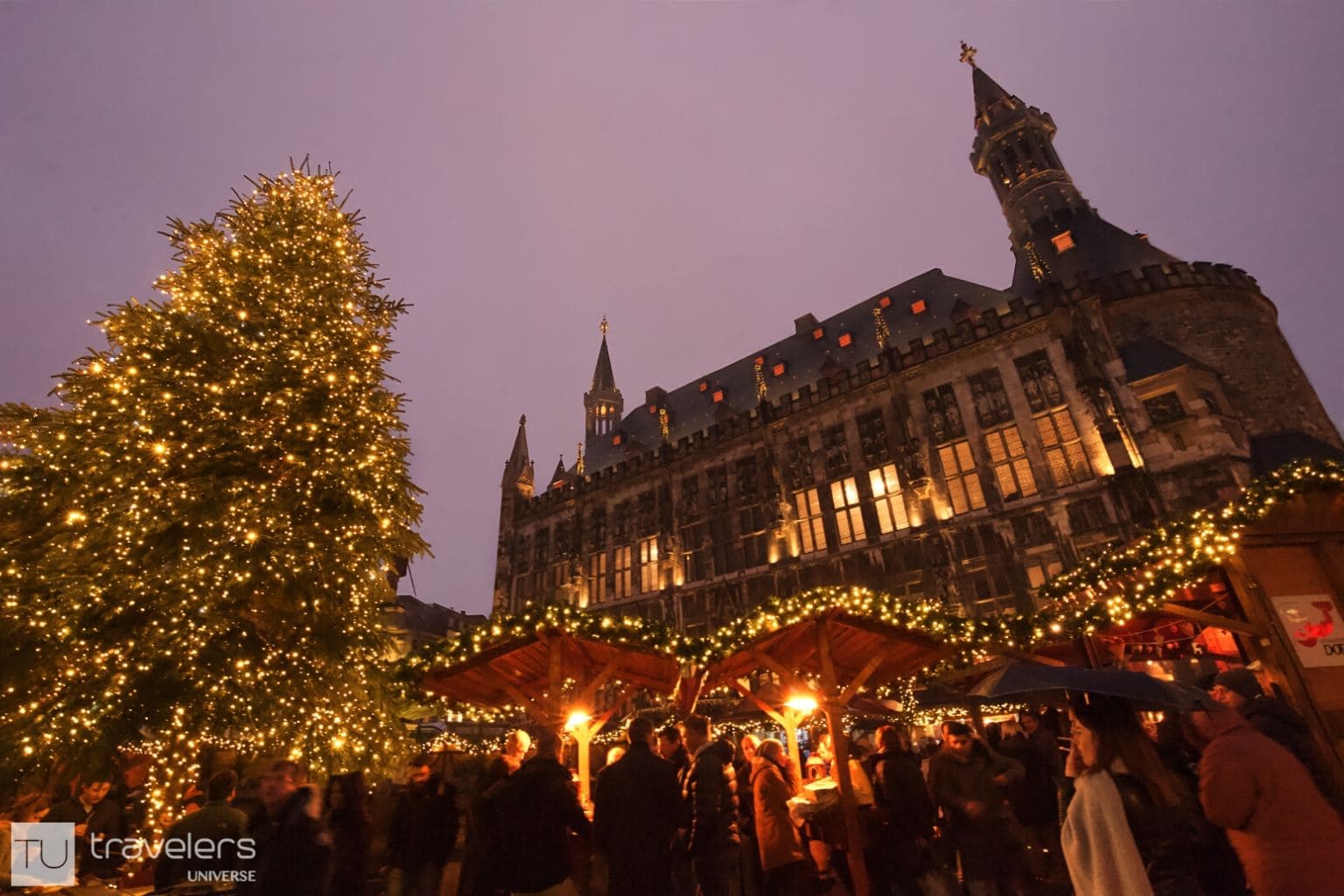 Aachen Christmas market view with fir tree and the town hall in the backdrop