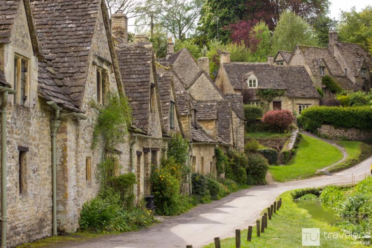A row of stone houses in Bibury, a beautiful village in the Cotswolds and one of the most unique day trips from London