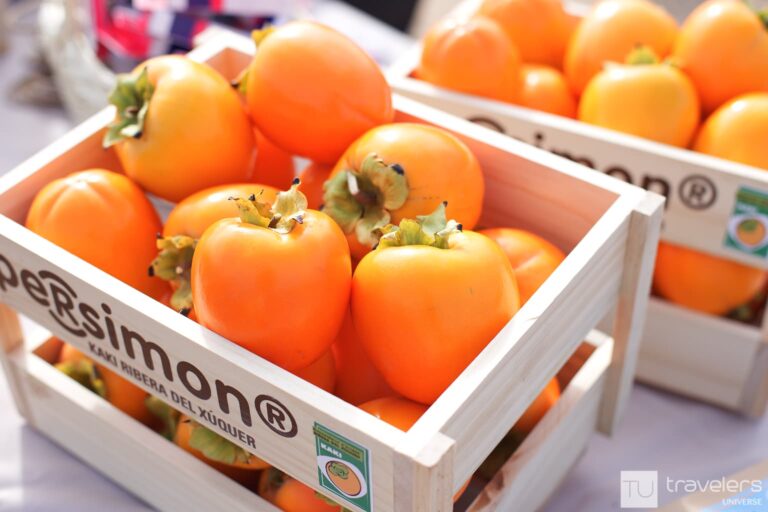 Boxes filled with persimmon, a fruit that, and this is one of the least known Spain facts, first appeared near Valencia