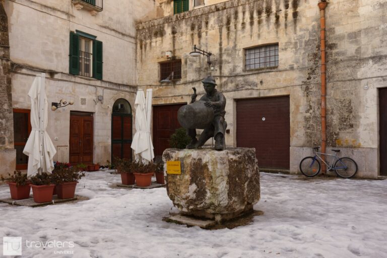 Bronze statue in the middle of a square in Matera, Italy