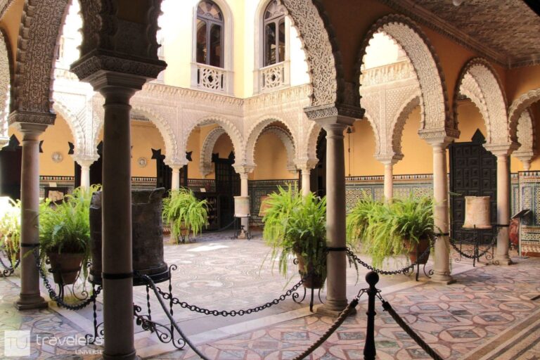 Ornate arches around a patio inside Palace of the Countess of Lebrija in Seville