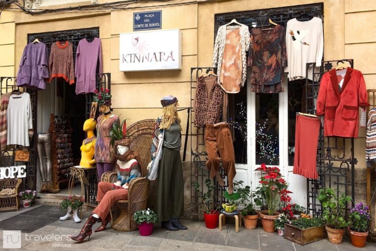 Colorful clothes by the entrance of Kinnara, a colorful shop in Valencia