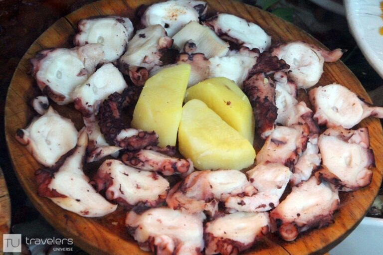 Galician style octopus on a wooden plate