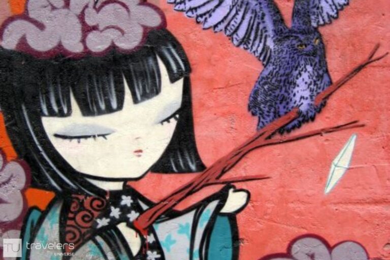 Colorful graffiti art depicting a Japanese girl and an owl