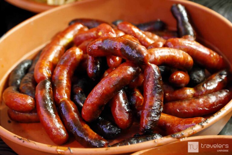 Red Spanish sausages on a terracotta plate