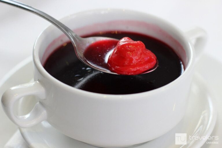 A bowl of traditional Polish beetroot soup with dumplings