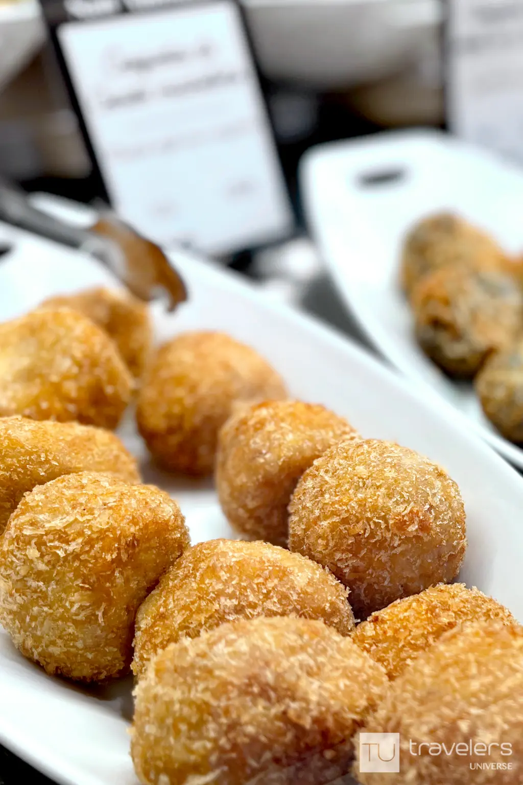 Different types of croquettes, a popular tapas dish in Spain, on a while plate
