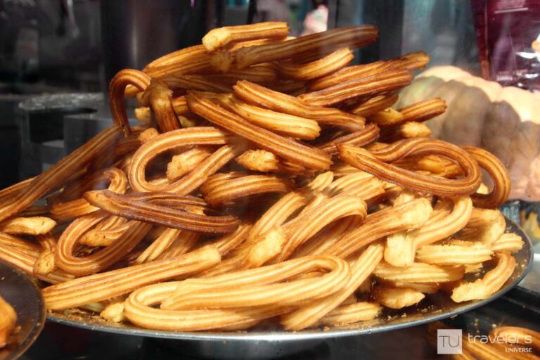 A pile of churros on a plate