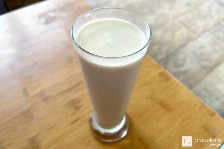 Spanish horchata in a tall glass on a wooden table