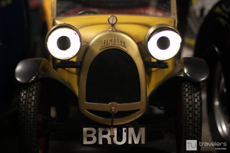 A small yellow car with the name Brum engraved at Motoring Museum in Bourton-on-the-Water