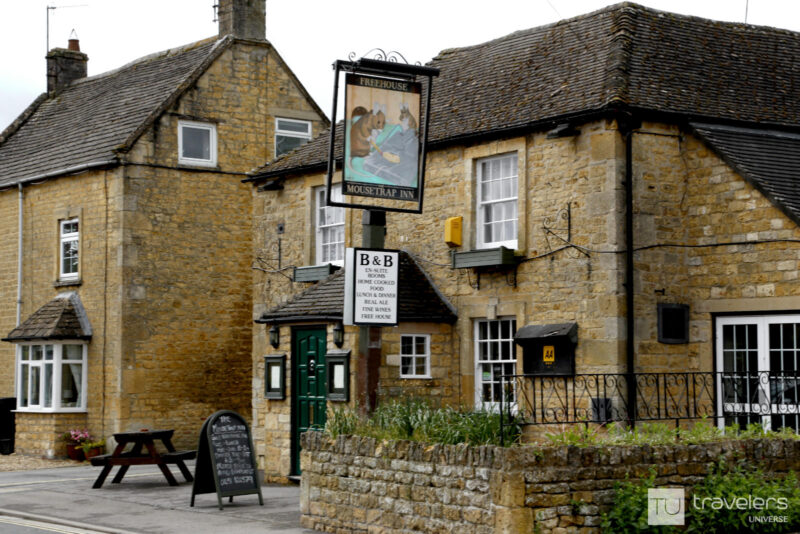The honey-colored facade of the Mousetrap Inn in Bourton on the Water