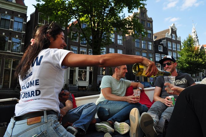 Discover Amsterdams Canals: Relaxing Open Boat Cruise Adventure! - Unique Perspective of Iconic Landmarks