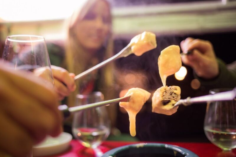 Zurich: Swiss Cheese Fondue and Wine E-Tuk-Tuk Tour - Savoring Swiss Cheese Fondue