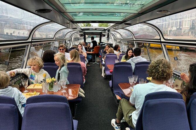 A Luxurious Cheese & Wine Canal Cruise Through Historic Amsterdam - Insights From Knowledgeable Guides