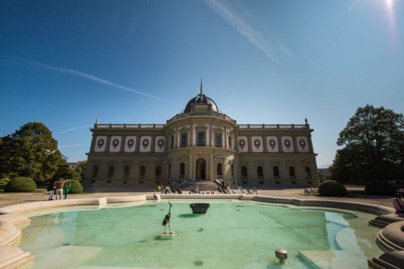 Geneva Uncovered: Scenic Open-Top Sightseeing Bus Tour - Watchmaking Heritage at the Flower Clock