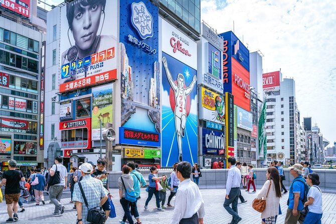 Osaka Food Adventure Tour: Walking With a Local Guide - Indulging in Iconic Osaka Delicacies