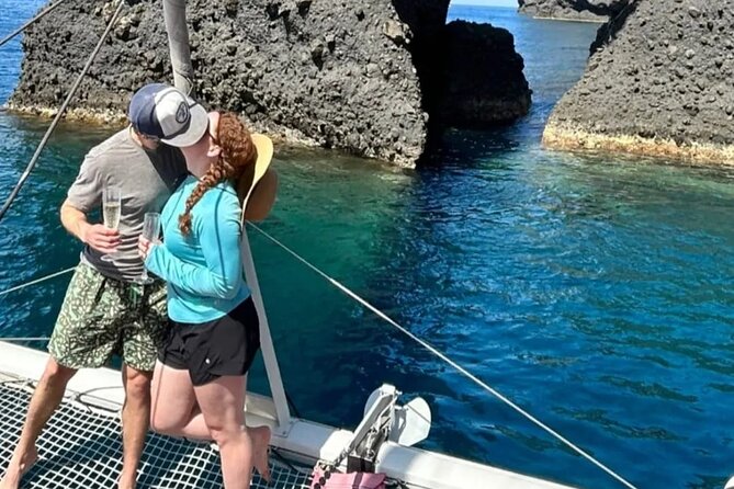 Santorini Private Catamaran Cruise With Meal and Drinks - Onboard Activities and Relaxation