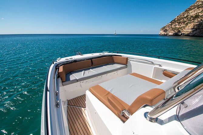 Cagliari 3 Hours Luxury Motorboat Tour - Wine and Snorkeling - Enjoying Local Homemade Wine