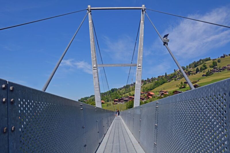 From Interlaken: Beatus Caves, Blue Lake and Lake Thun Tour - Crossing the Sigriswil Suspension Bridge