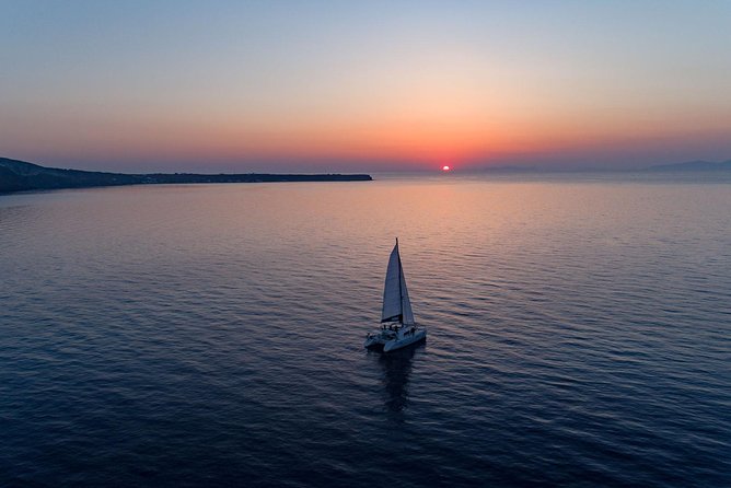 Luxury Sunset Cruise With Swim Stops, BBQ Meals and Open Bar - Exciting Swim Stops at Red Beach and Volcanic Island