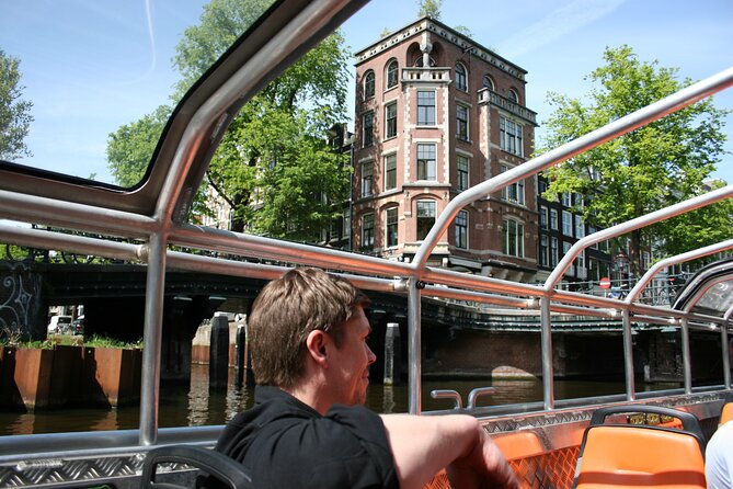 Amsterdam 1-Hour Sightseeing Canal Cruise by Semi-Open Boat - Engaging Audio Guide in Multiple Languages