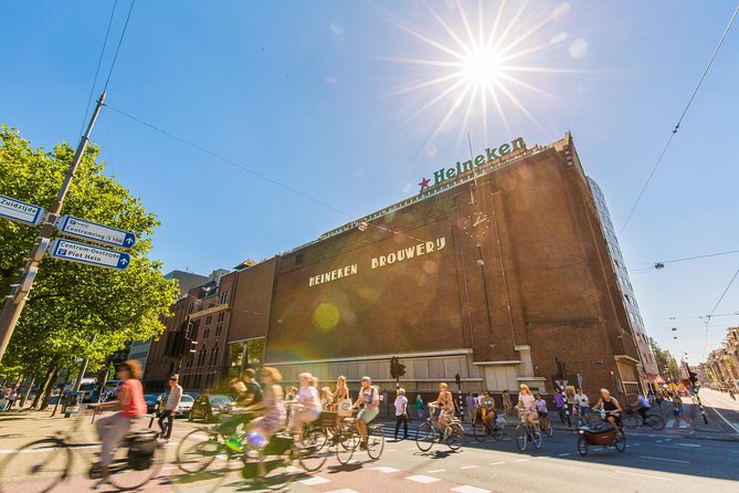Heineken Experience Amsterdam and Canal Cruise With Snackbox - Enjoying the Free Beer Tasting