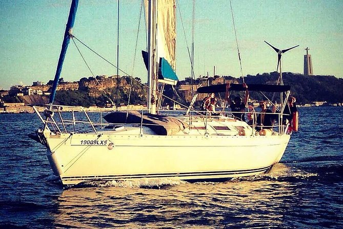Lisbon Sunset Sailing Tour with White or Rosé Wine and Snacks