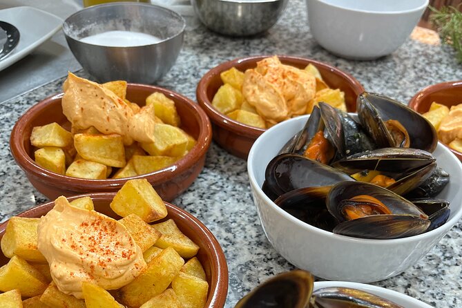 Seafood paella cooking class, tapas and visit to Ruzafa market.