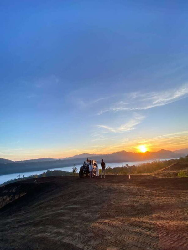Jeep 4wd with sunrise & black lava - Sunrise at Mount Batur: A Moment of Pure Magic