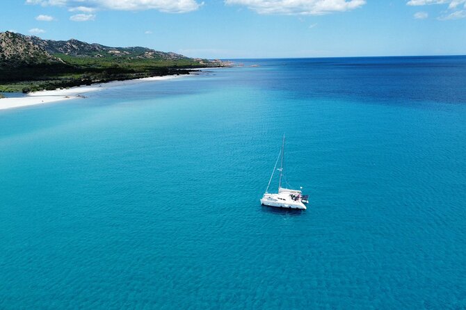 Private catamaran sailing trip around La Caletta -Berchida - Sardinia - The Sum Up