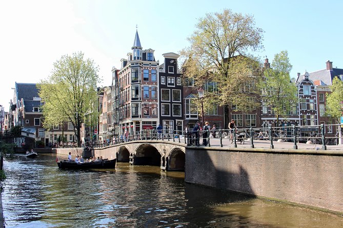 Amsterdam Canal Cruise on a small open boat (max 12 guests) - The Sum Up