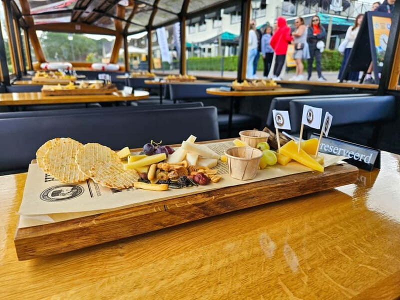 Amsterdam: Live GuideD Giethoorn Boat Tour & Cheese Platter - Free Time to Explore