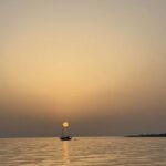 Argostoli: Sunset Cruise with Swim Stops, Dinner, and Wine - Itinerary Breakdown