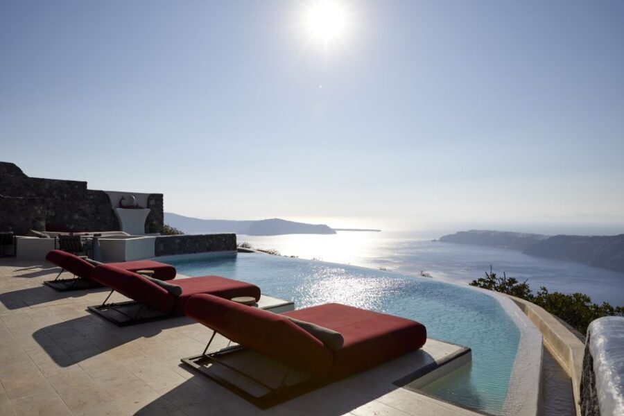 Daybed Relaxation with infinity pool use with caldera views - The Setting: An Enchanting Greek Escape