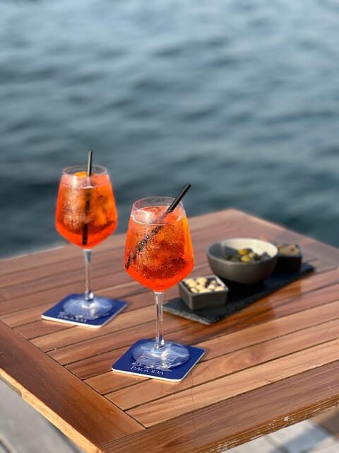 Italian aperitif at the sunset by the sea - The Setting and Atmosphere