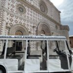 L'Aquila: Electric Shuttle City Tour with Local Guide - Exploring LAquila in an Electric Shuttle
