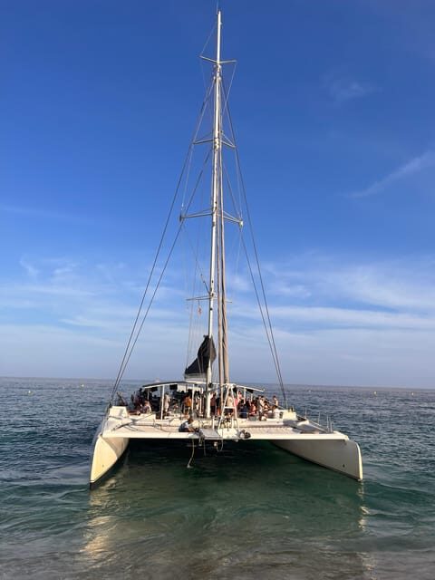 Lloret de Mar: Sunset Catamaran Cruise with DJ and Drinks - The Value Proposition