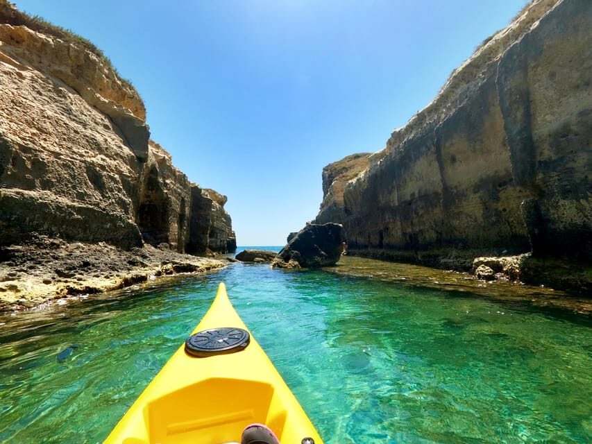 Roca Vecchia: Kayak and Canoe Tour to La Grotta della Poesia - The Itinerary: From Caves to Swims