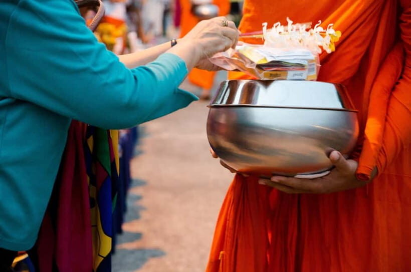 Early morning Doi Suthep with monk chanting and alms - The Monks’ Alms Procession: A Sacred Ritual