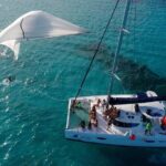 Catamaran Tour to Isla Mujeres, Open bar, Lunch, Snorkeling, Beach Club Included - Authentic Experiences and What Travelers Say