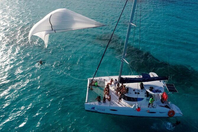 Catamaran Tour to Isla Mujeres, Open bar, Lunch, Snorkeling, Beach Club Included - Authentic Experiences and What Travelers Say
