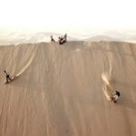 Ica - Huacachina | Sandboarding + Buggy | - Sandboarding: Sliding Down the Dunes