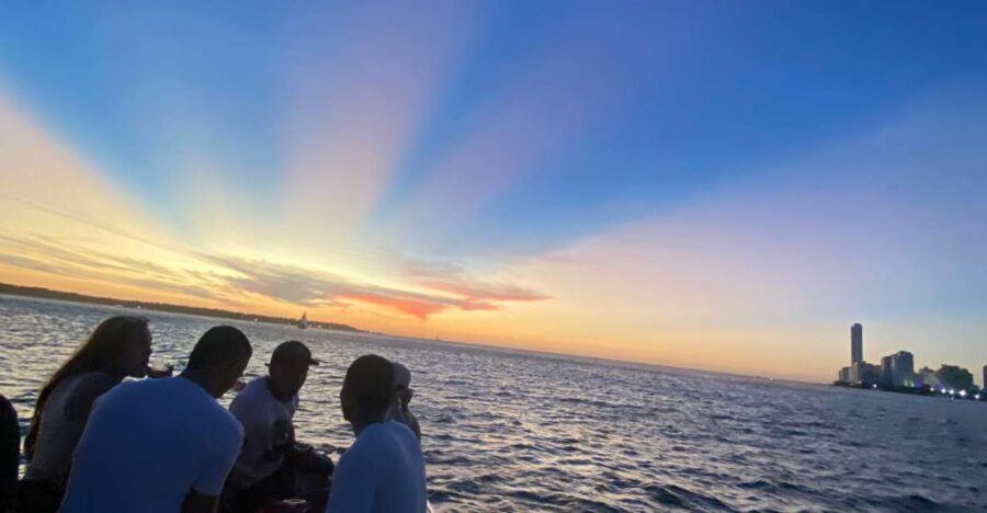 Sunset Party open bar on the bay while sharing with locals - The Sum Up