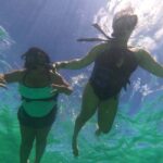 Bávaro: Punta Cana Catamaran Tour with Open Bar and Snacks - Music and Social Atmosphere