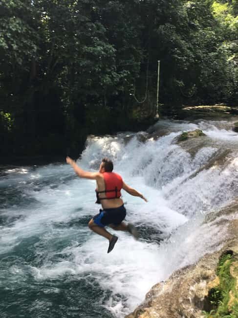 Montego Bay: Blue Hole, Dunn's River Falls, and Zipline Tour - Exploring the Blue Hole: Ropes, Water, and Jungle Vibes