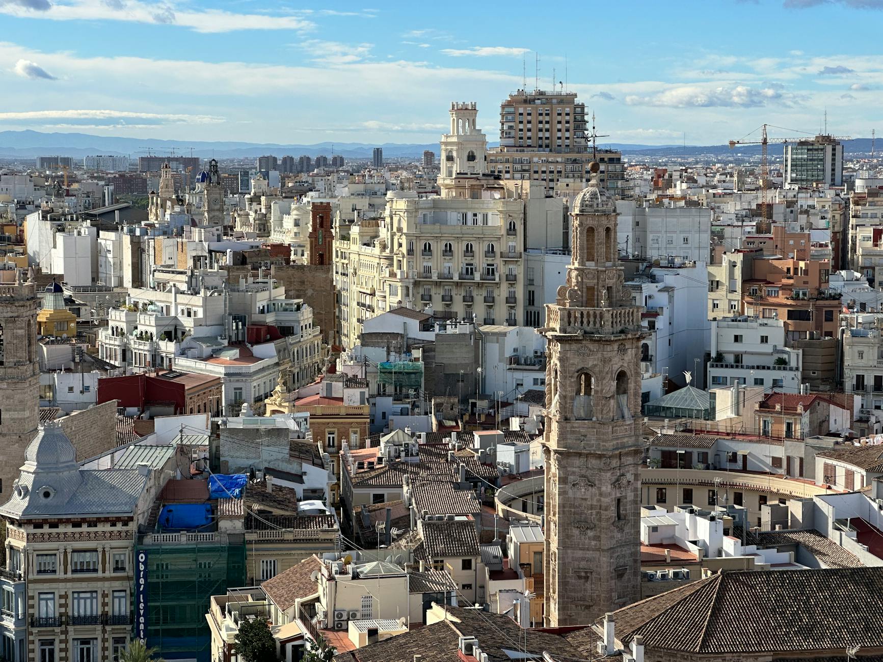 Aerial view of Valencia old town with terracotta rooftops and church towers