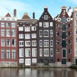 Historic canal houses along Amsterdam waterway