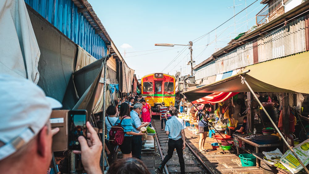Stalls and shoppers inside Chatuchak Weekend Market in Bangkok