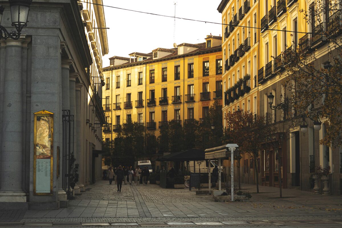 Warm sunset over a Madrid street with historic buildings