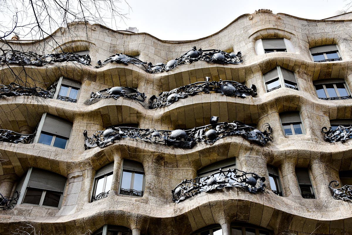 The wavy stone facade of Casa Mila also known as La Pedrera designed by Gaudi in Barcelona